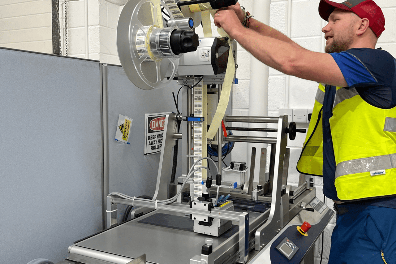 udaFORMAXX Carton Feeder Speeds Coding and Reduces Handling for Optibac - PrintSafe